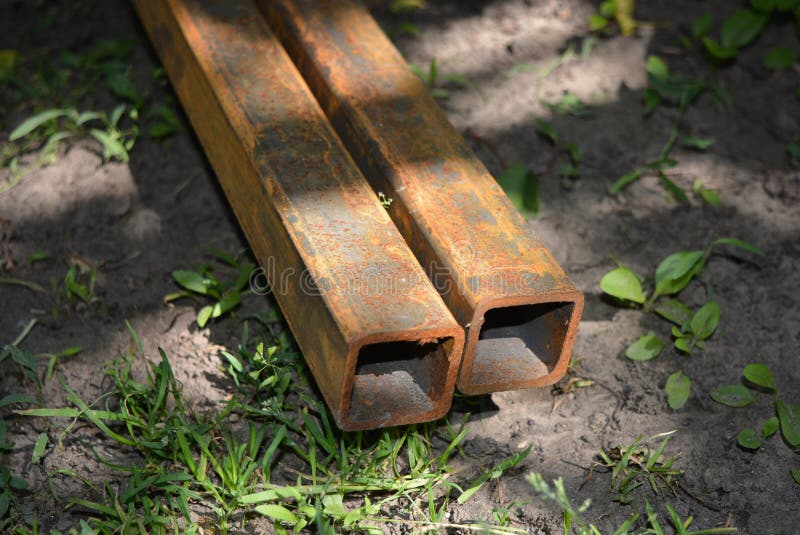 A Long, Thick, Metal Profile with a Small Amount of Red Rust Located on ...