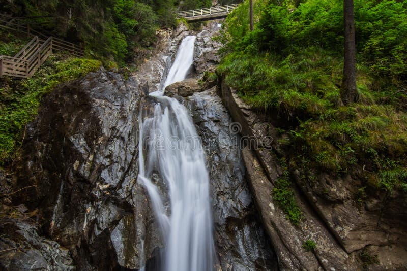 Long Thin Waterfall Over Rocks while Hiking Stock Photo - Image of ...