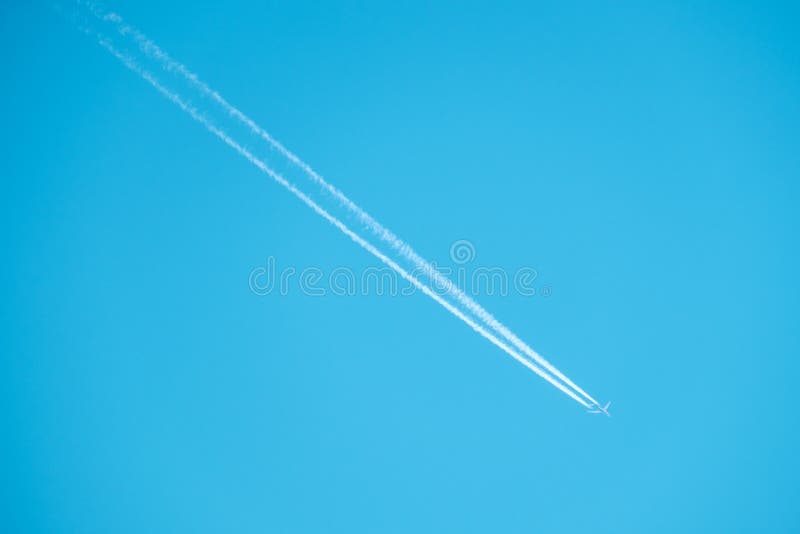 Trail of Jet Plane on Blue Sky Stock Photo - Image of white, motion ...