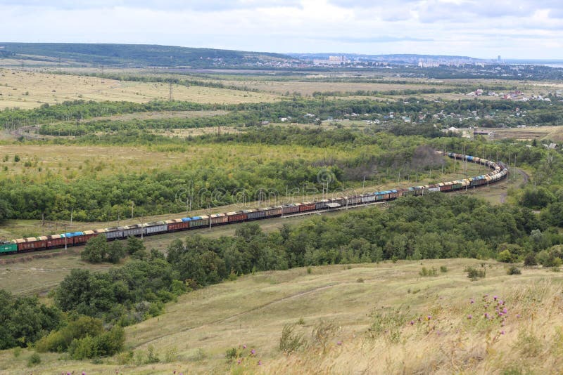 A Long Train Loaded with Double-stack Cargo Containers Winds Its Way ...
