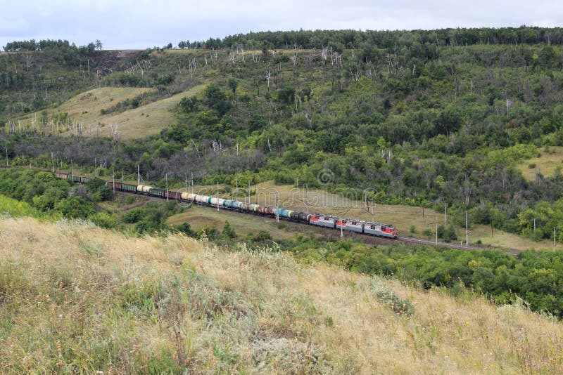 A Long Train Loaded with Double-stack Cargo Containers Winds Its Way ...