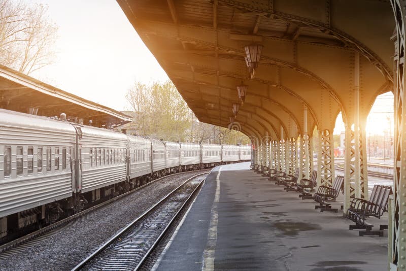 Long Train of Passenger Cars Arriving at the Station Stock Photo ...