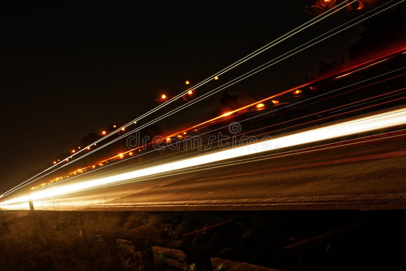 A Long Train Track with a Bright Light Shining on it Stock Image ...