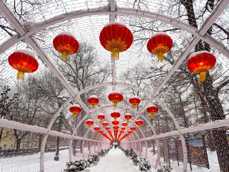 A Long Tunnel with Red Lanterns Hanging from the Ceiling Stock Image ...