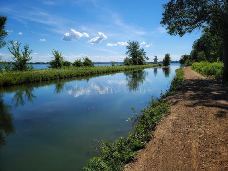 Long Water Canal with a Pathway and Trees by the Sides. Stock Image ...