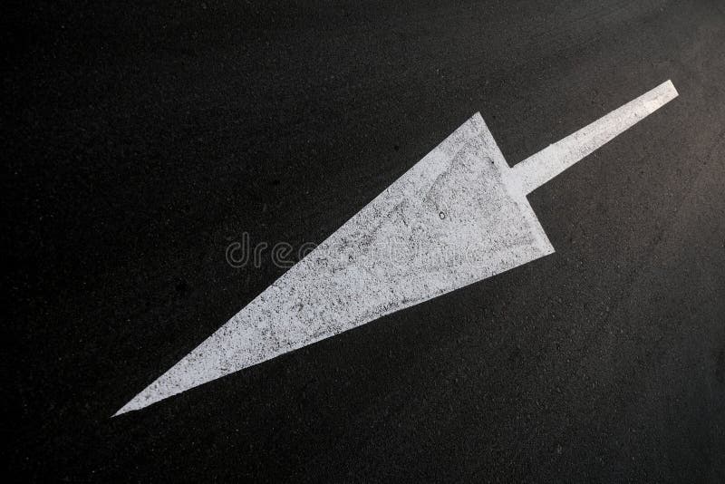 Big White Diagonal Arrow Sign, Painted on Black Asphalt Road, Road ...