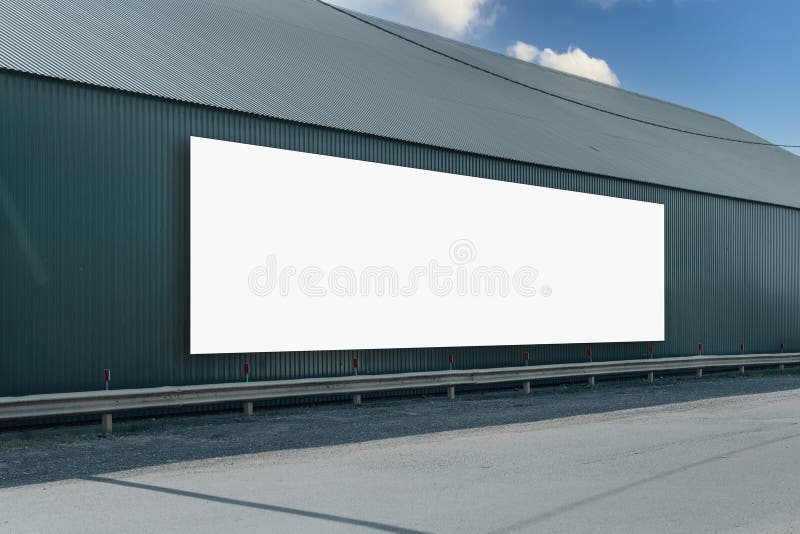 Long White Blank Commercial Banner Mounted on Building Wall on Roadside ...