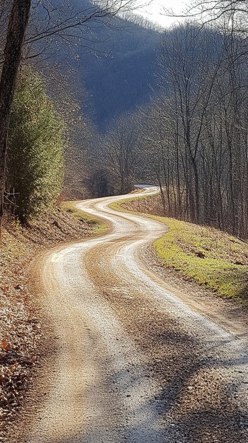 Long Winding Country Road Leading into the Mountains. Stock Image ...