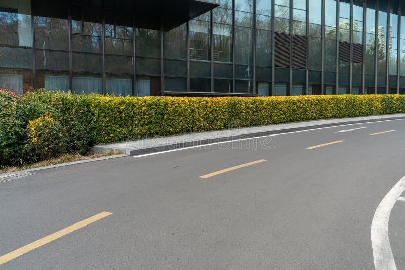 Long Winding Road in Front of a Building with Multiple Windows Stock ...