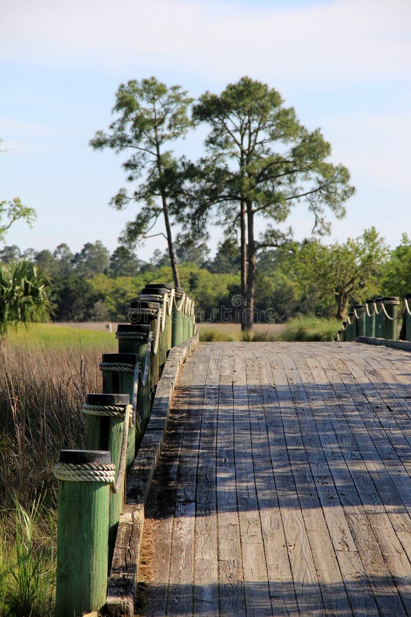 Long Wood Bridge Curving Over Stream Stock Photo - Image of long, calm ...