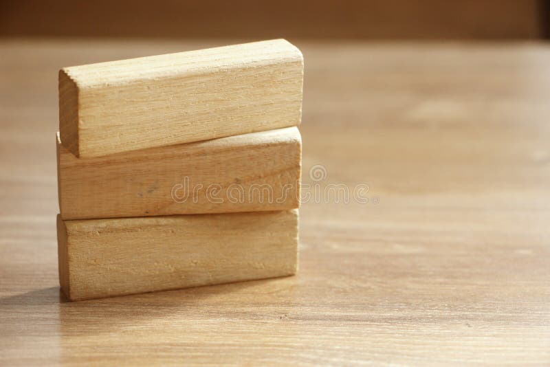 3 Long Wooden Blocks on Wooden Table. Education and Business Concept ...