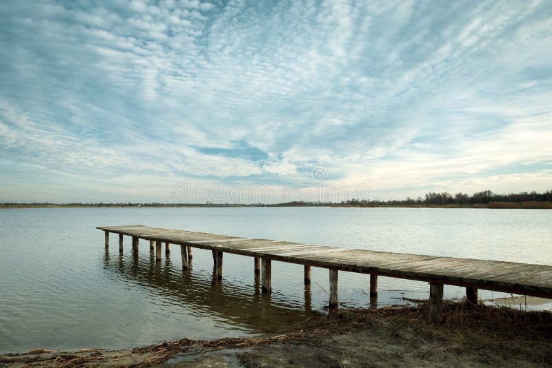 A Long Wooden Bridge on the Water and Cloudscape, Staw, Poland Stock ...