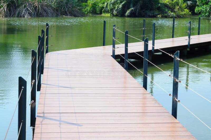 A Long Wooden Foot Bridge in a Park Stock Image - Image of landscape ...