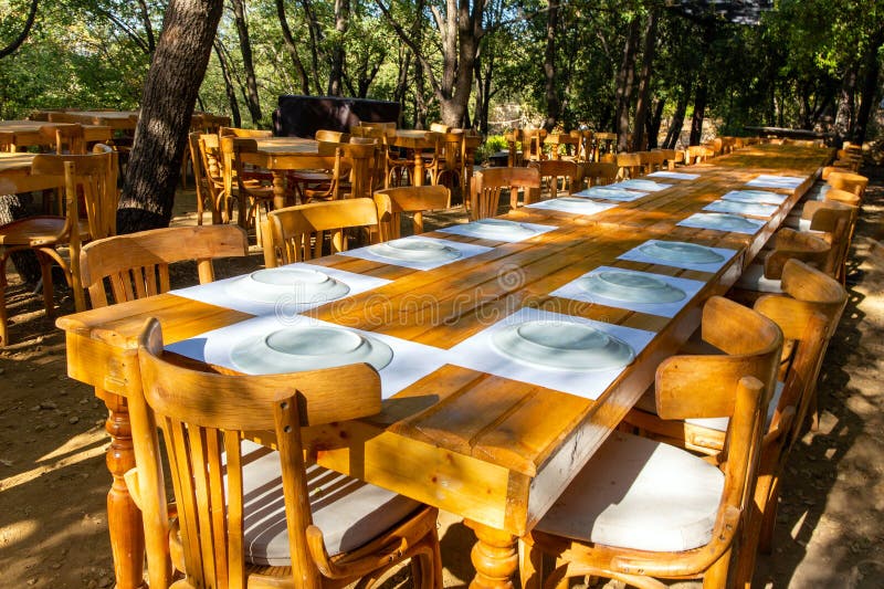 Long Wooden Table for Group of Guests in a Rustic Restaurant Stock ...