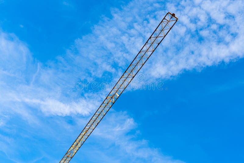 Long Yellow Crane Boom Against a Blue Sky Stock Image - Image of arrow ...