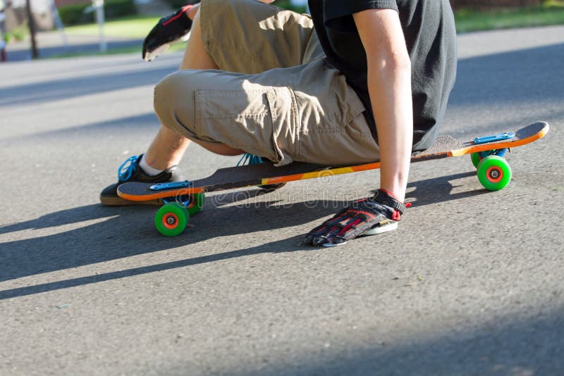 Longboarder Sitting stock photo. Image of skateboarding - 48458366