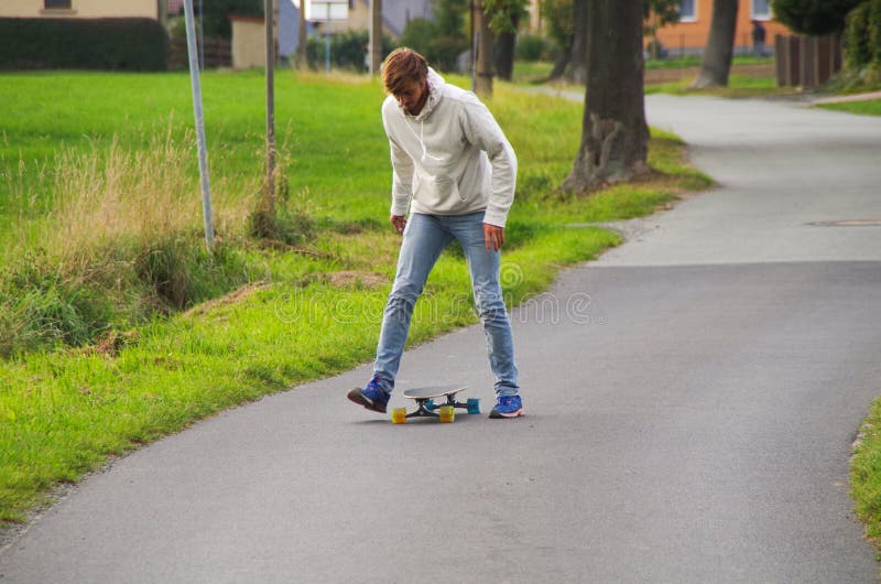 Longboarder on the Street Getting Back Onto Board Stock Photo - Image ...