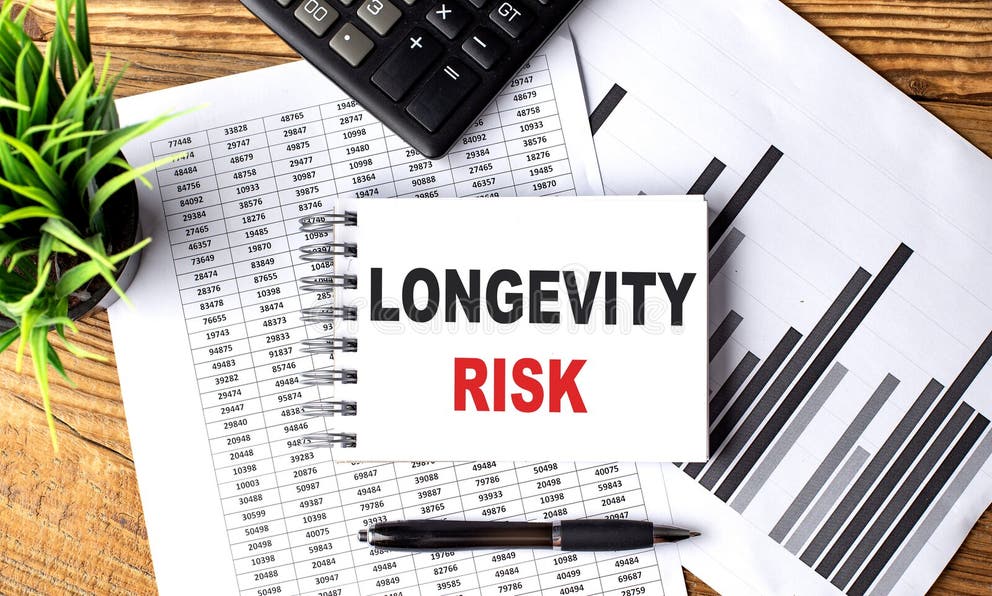 LONGEVITY RISK Text on a Notebook with Chart and Calculator Stock Photo ...