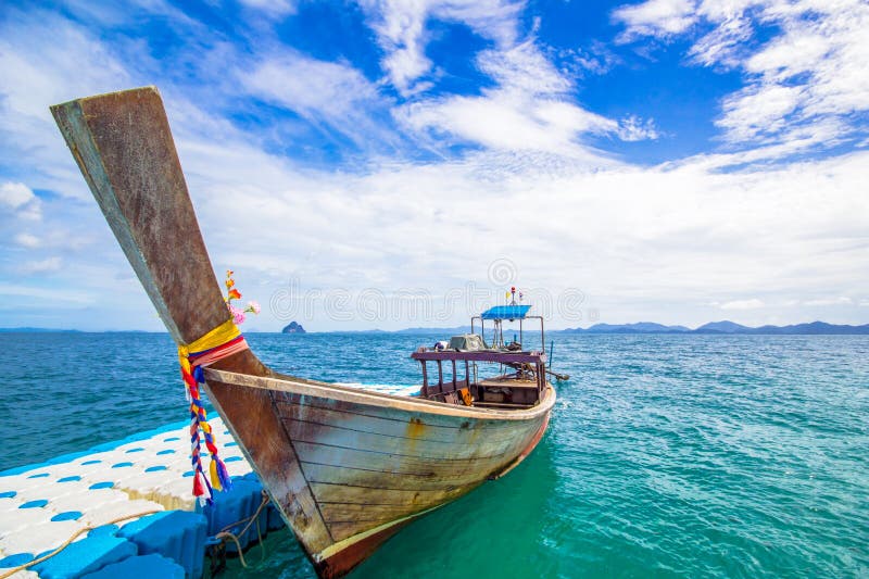 Longtail Boat and Blue Dock Stock Image - Image of clouds, beach: 26633425