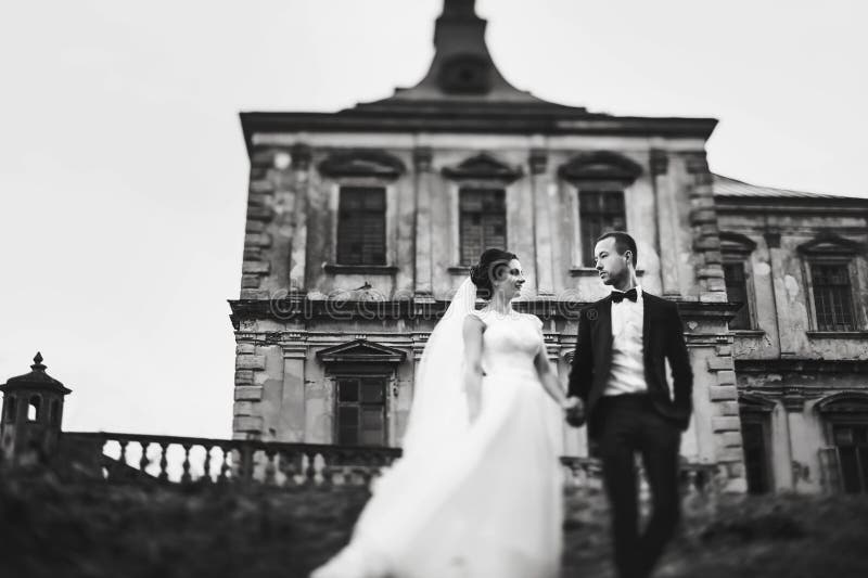 A Look from Below on a Wedding Couple Standing in the Front of a Stock ...