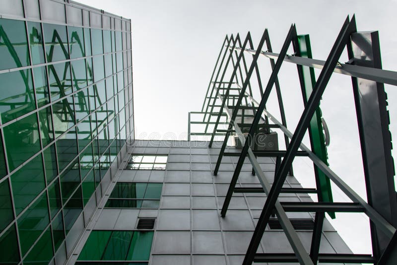 Modern Building with Green Windows and Triangles Stock Photo - Image of ...