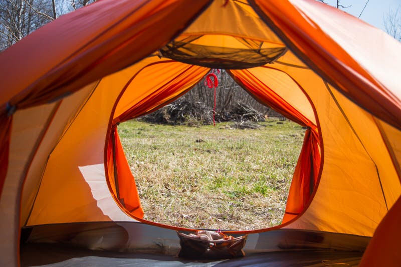 A Look through the Entrance of the Tent. Orange Camping Tent in an ...