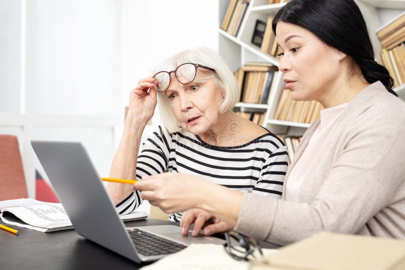 Professional Female Tutor Explaining Task Stock Photo - Image of asian ...