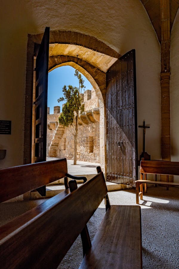 Look through Open Doors of Church in Castle of Capdepera Stock Photo ...