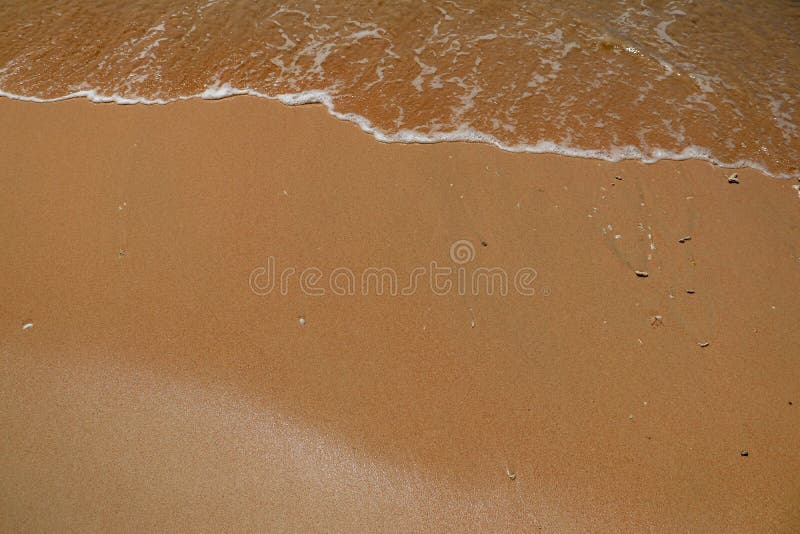 Look from the Top Corner Bubble Waves Hit the Beach on the Wet Sand ...