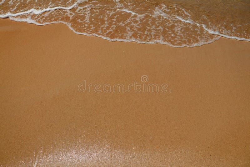 Look from the Top Corner Bubble Waves Hit the Beach on the Wet Sand ...
