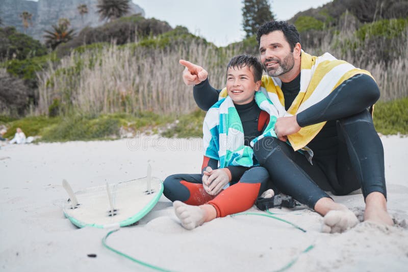 Look at that Wave, Dad. a Young Boy Out Surfing with His Father. Stock ...