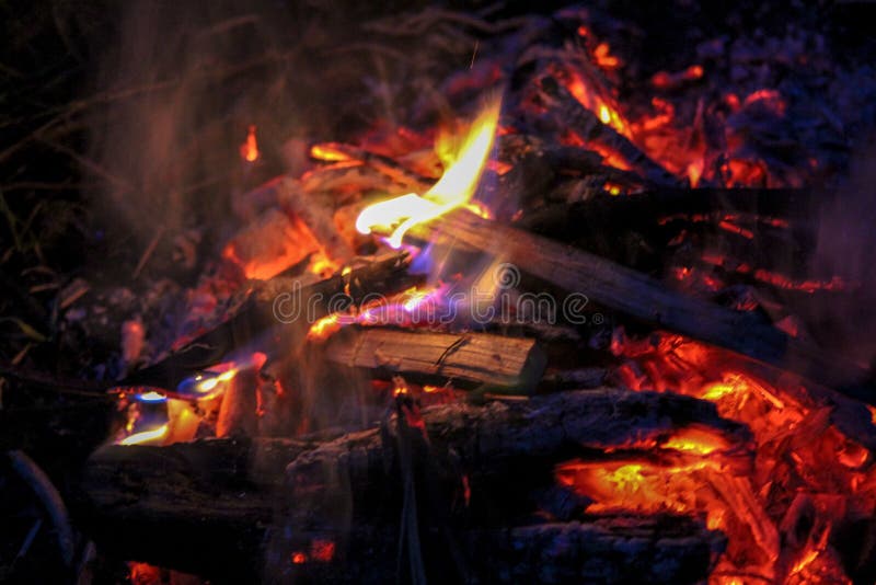A Look into a Well Lit Fire. Orange, Red and Black Highlights Stock ...
