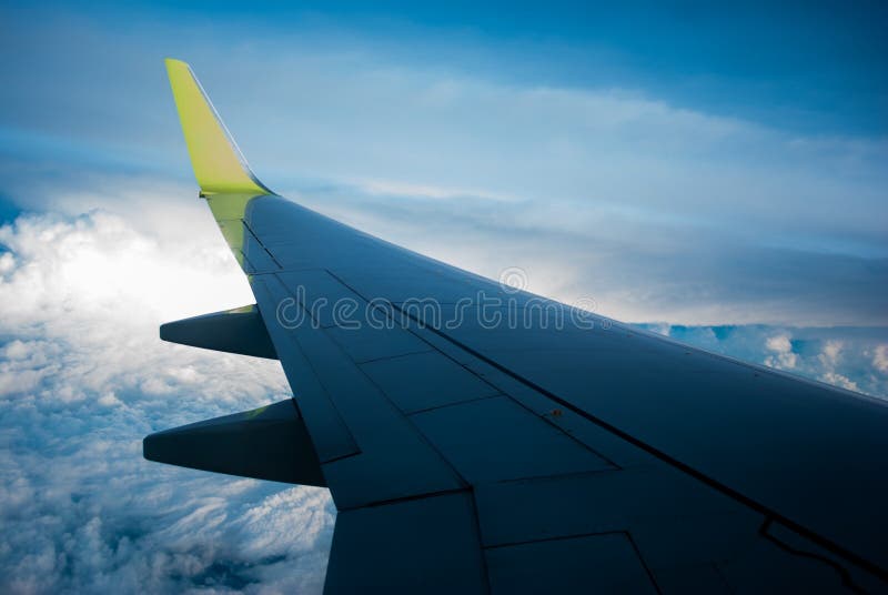 Look through the Wing of Airplane To the Clouds. Stock Photo - Image of ...