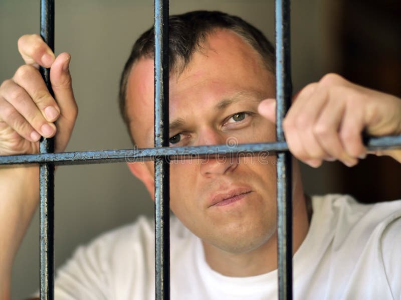 The Look of a Young Man from Behind Metal Bars Stock Photo - Image of ...