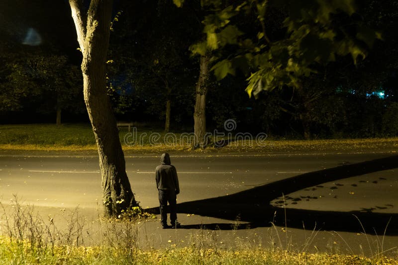 Lookig Down on a Mysterious Hooded Figure Standing on a Road ...