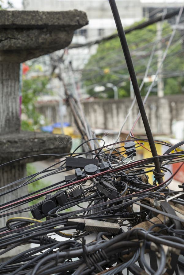 Tangled Mess of Eletrical Cables,outdoors and Above the Streets of ...