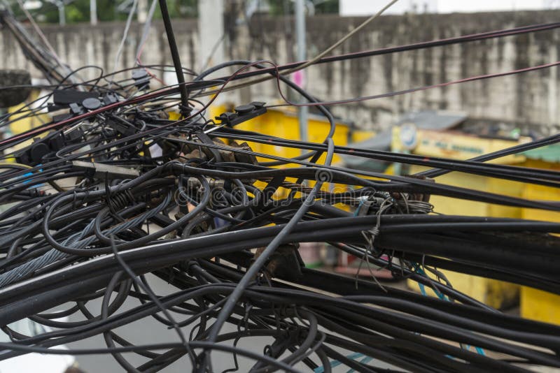 Tangled Mess of Eletrical Cables,outdoors and Above the Streets of ...