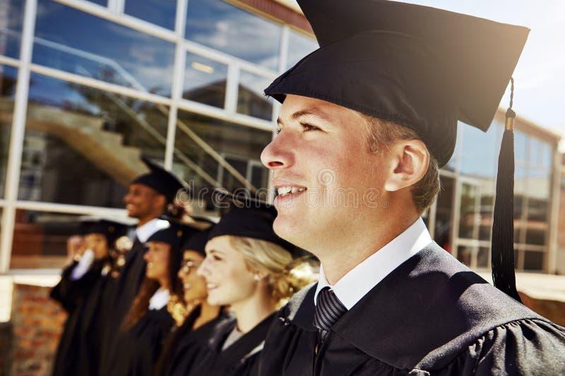 Looking Ahead To His Future. Students Standing Outside on Graduation ...