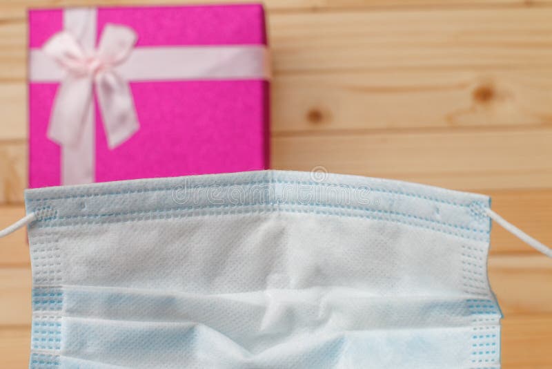 Looking through a Blue Surgical Mask on a Small Rectangular Present ...