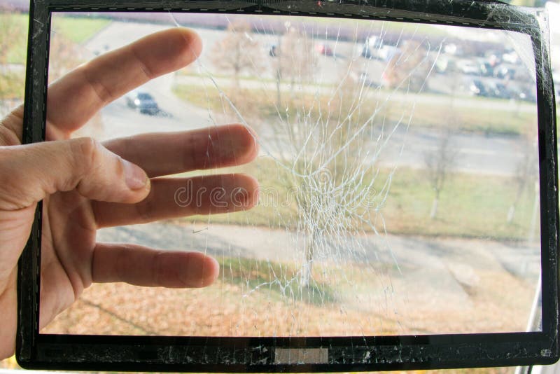 Looking through the Broken Touch Screen Damaged Tablet Computer. a ...