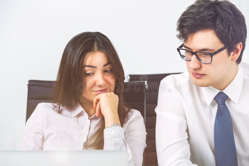 Looking at computer screen stock image. Image of people - 70332133