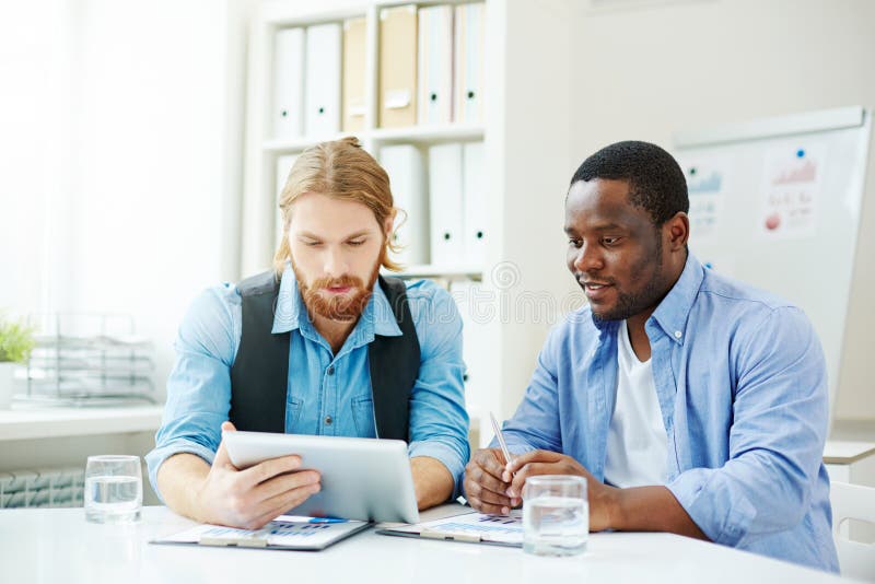 Looking at data stock photo. Image of businesspeople - 71225960