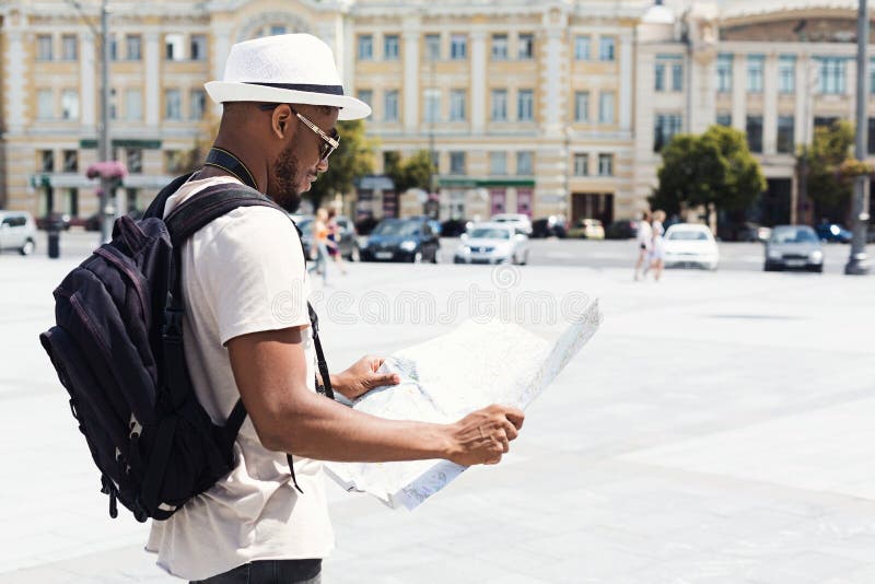 Looking for Directions. Lost Tourist Looking at City Map Stock Image ...