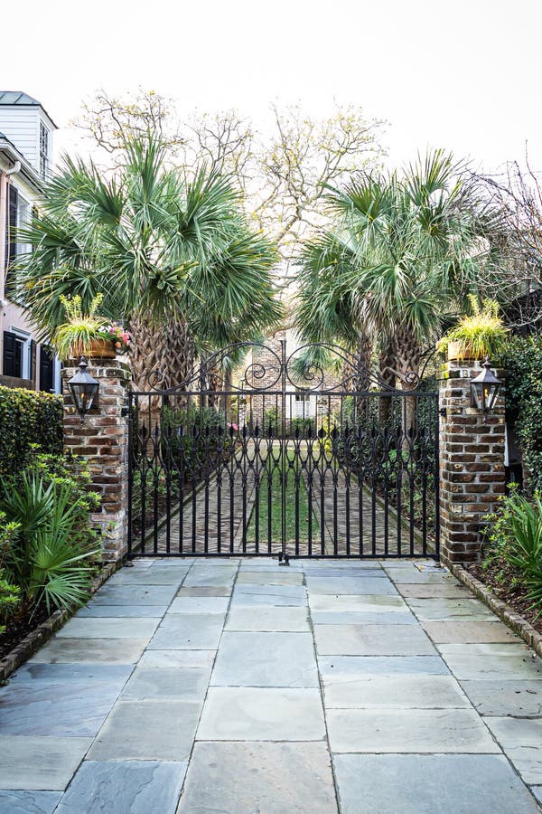 Looking Down a Alley with a Stone Surface and a Security Gate Stock ...