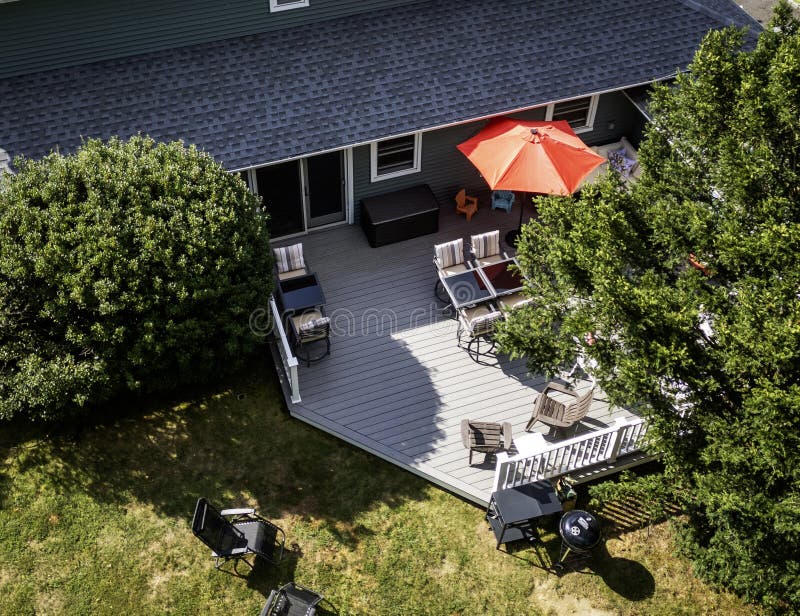 Looking Down at a Backyard Composite Deck with Furniture Set Up for a ...