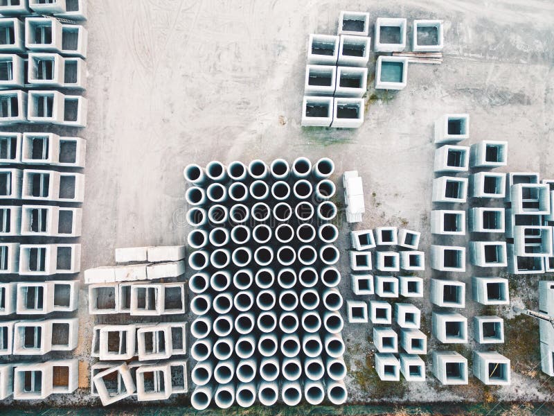 Looking Down at Concrete Blocks and Pipes Neatly Stacked in Rows on the ...