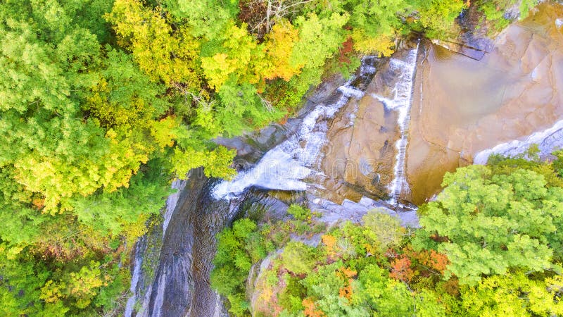 Looking Down Over Waterfall Going into Deep Gorge Surrounded by Green ...