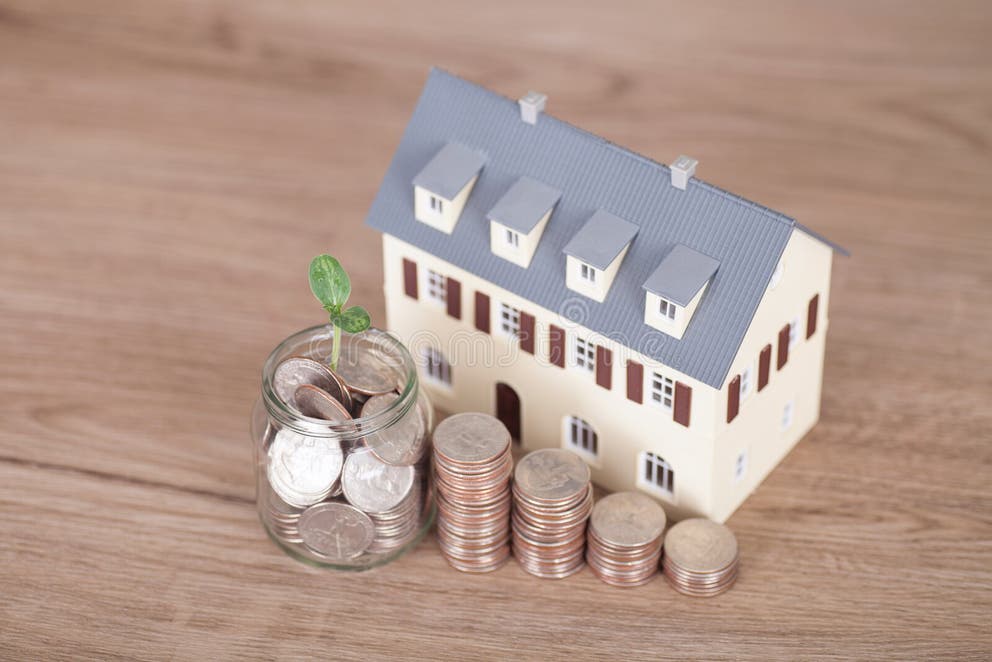 Looking Down Shooting Dollar Coins and House Model on the Table Stock ...
