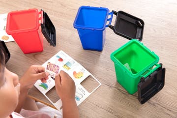 Looking Down and Shooting, the Little Girl is Learning about Garbage ...