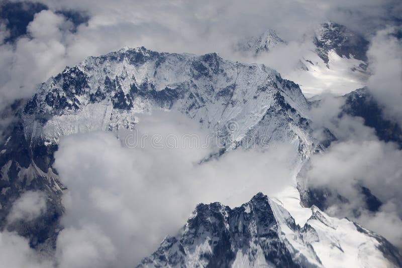 Looking Down Snowy Mountains Stock Photo - Image of covered, nature ...